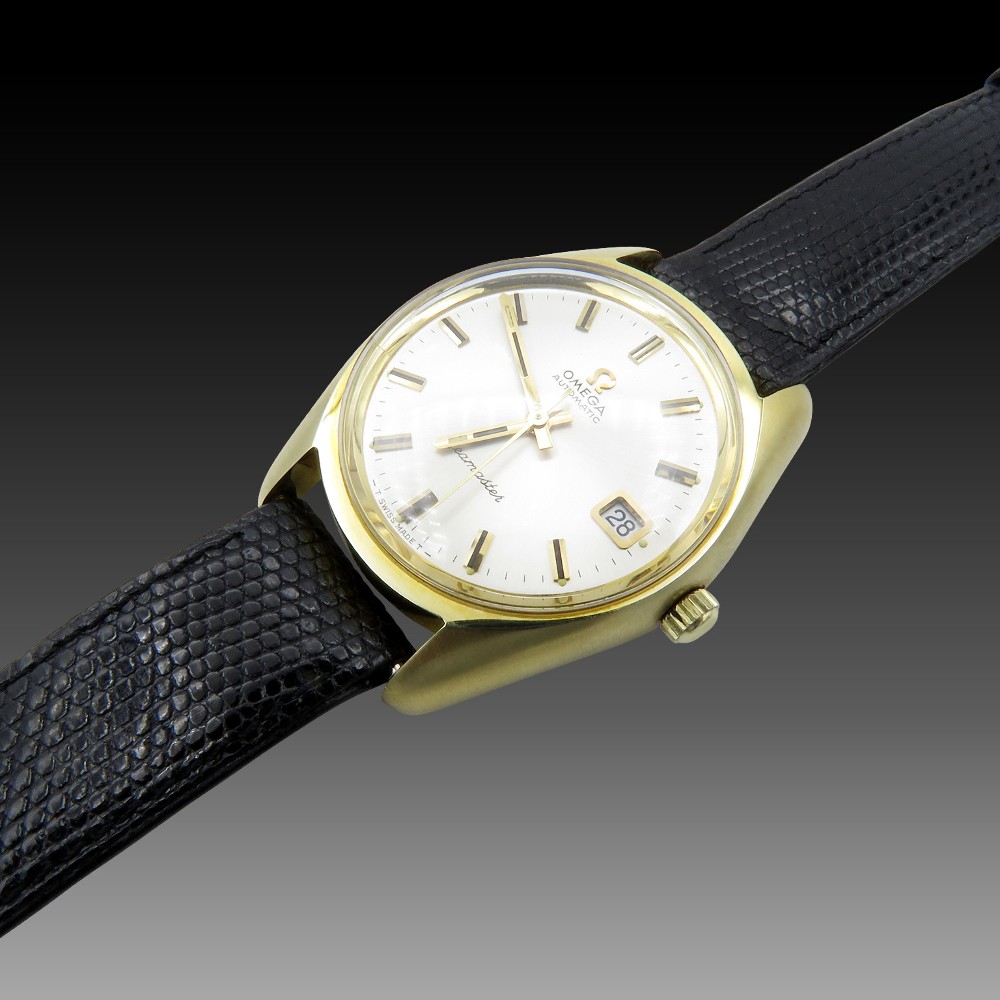 Montre Omega Seamaster MÃ©tal dorÃ© de 1961. Stock neuf. 35 mm.