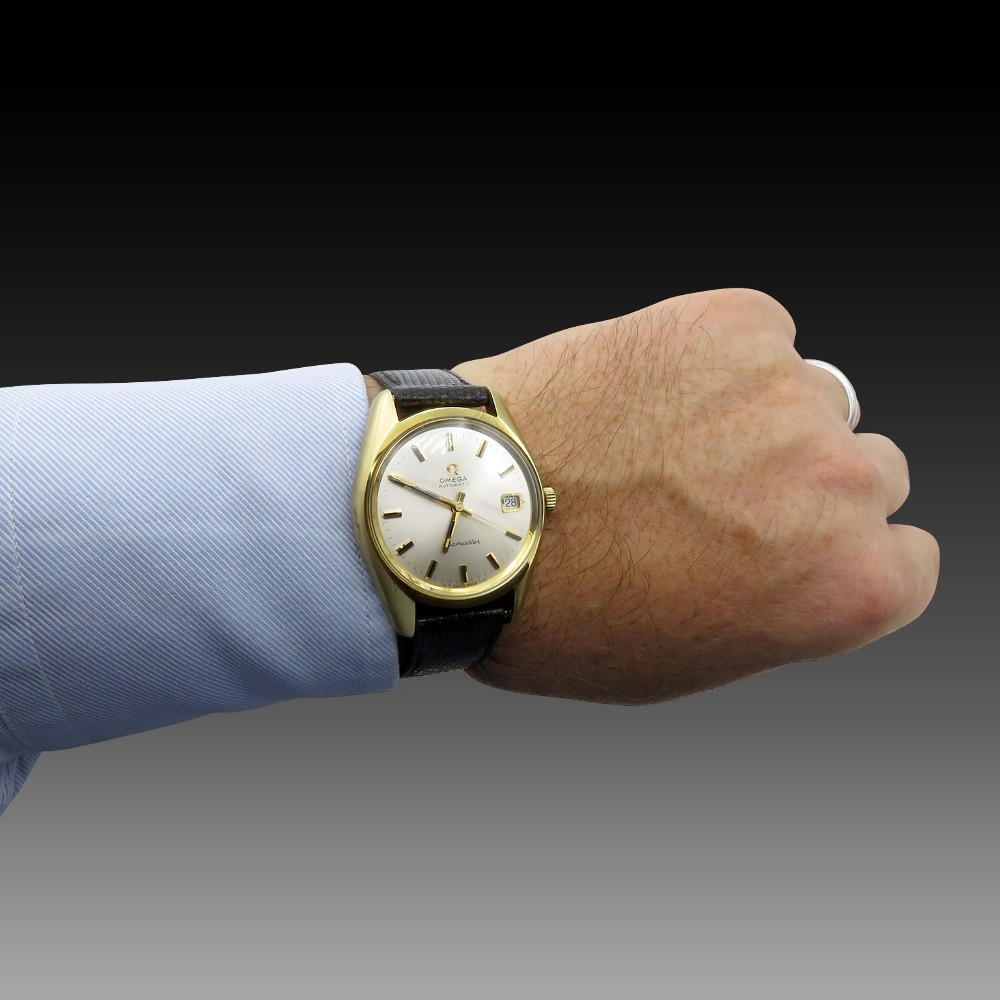 Montre Omega Seamaster MÃ©tal dorÃ© de 1961. Stock neuf. 35 mm.
